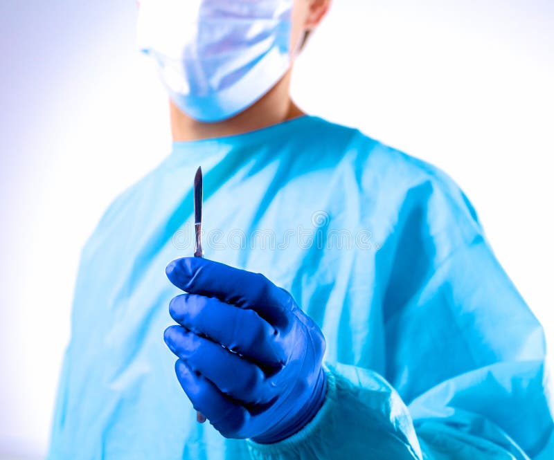 Man Surgeon Holds a Scalpel in an Operating Room Stock Image - Image of ...