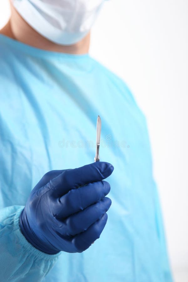 Man Surgeon Holds a Scalpel in an Operating Room Stock Photo - Image of ...