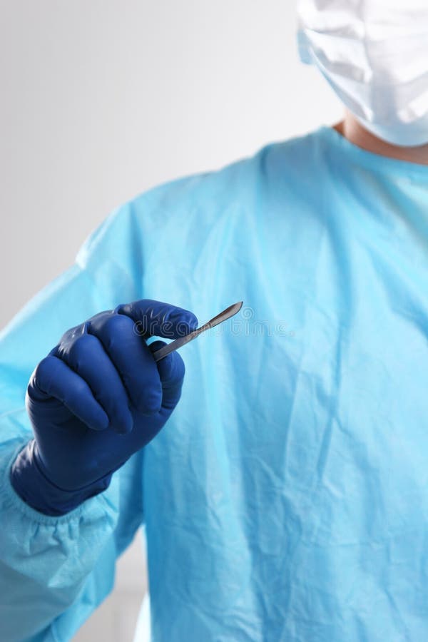 Man Surgeon Holds a Scalpel in an Operating Room Stock Photo - Image of ...
