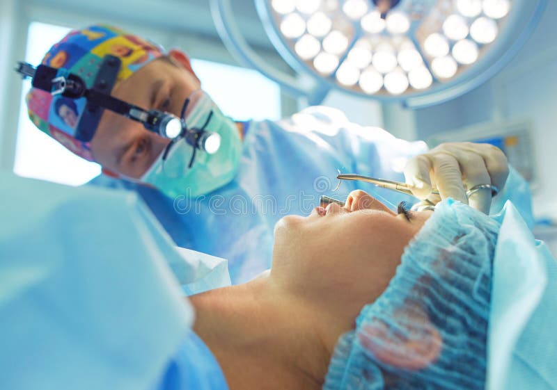 Man Surgeon at Work in Operating Room Stock Photo - Image of lamp ...