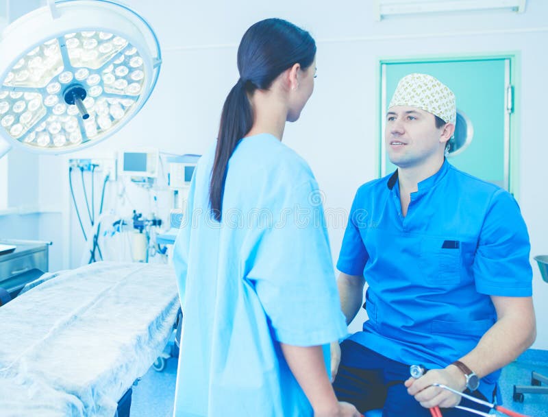 Man Surgeon at Work in Operating Room Stock Photo - Image of coat ...