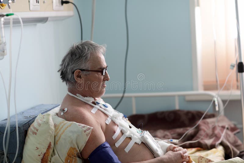 Man after surgery stock image. Image of dropper, inside - 29823029