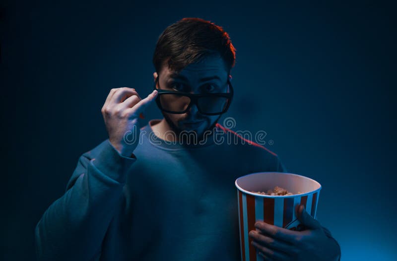 Man with Surprised Expression and Popcorn. Emotion while Watching a ...