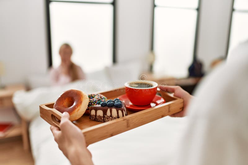 Man Surprising His Girlfriend with Breakfast on the Bed at Home Stock ...