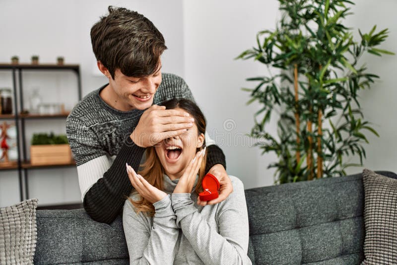 Man Surprising Woman with Engagement Ring at Home Stock Image - Image ...