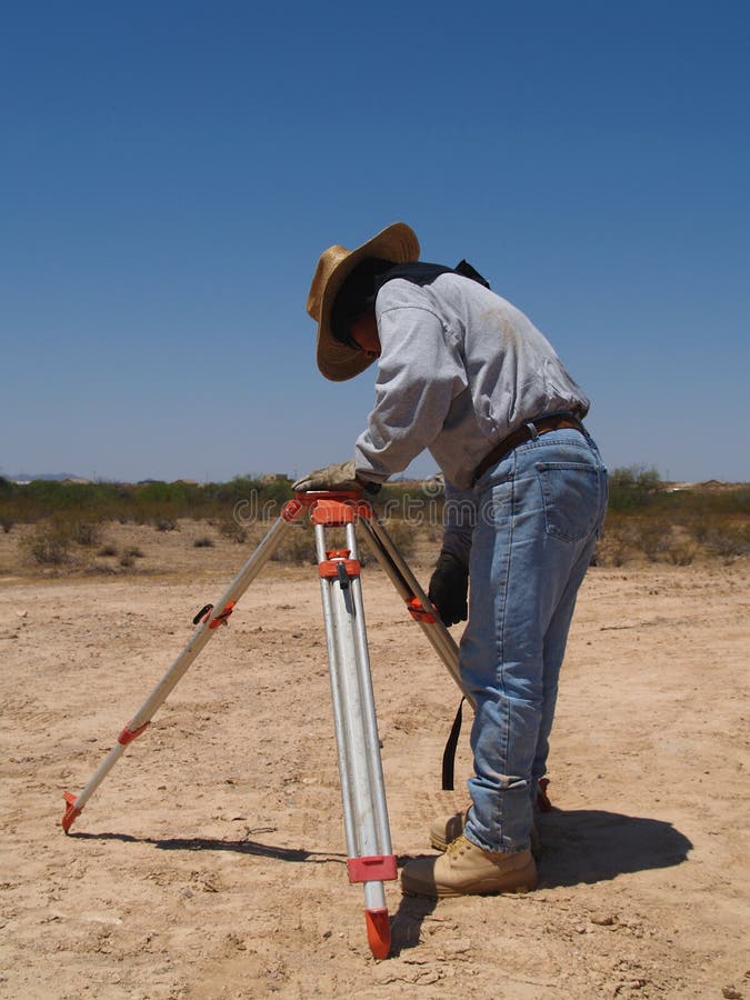 Man Surveying at Excavation Site - Vertical Stock Photo - Image of land ...