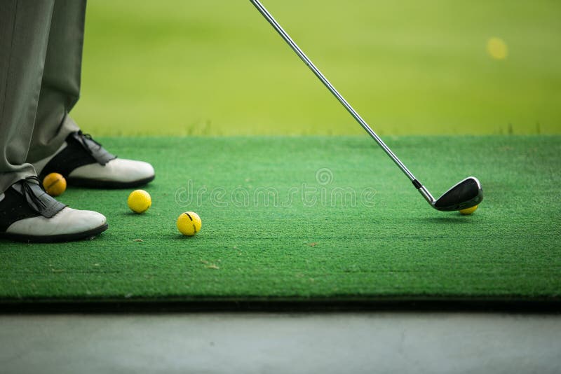 Man Sweeping Ball on Golf Course Stock Image - Image of ball, business ...