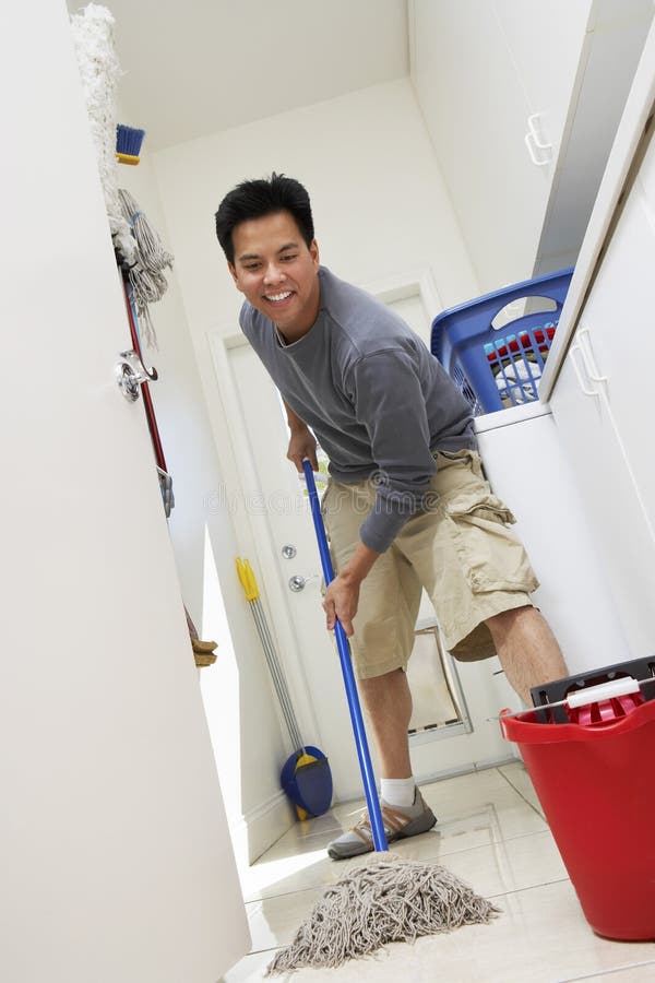 Man Sweeping Floor at Home stock image. Image of hygiene - 29651659