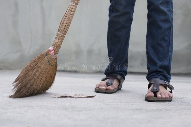 A man sweeping the floor. stock image. Image of maid - 101898385