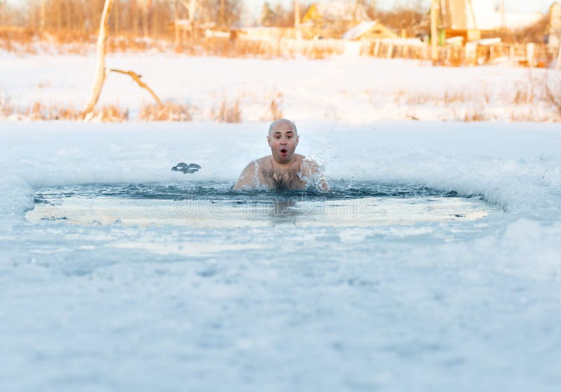 Man swimming cold water stock image. Image of frosty - 48930439