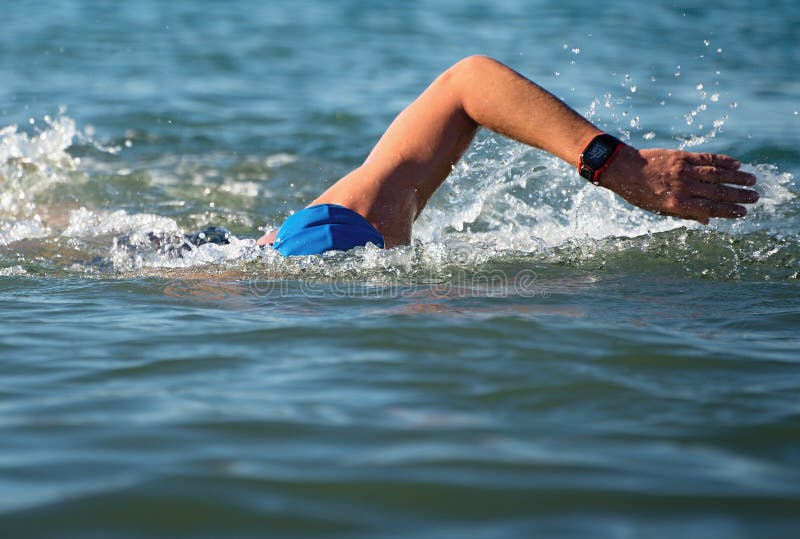 A man swimming front craw stock photo. Image of human - 65968848