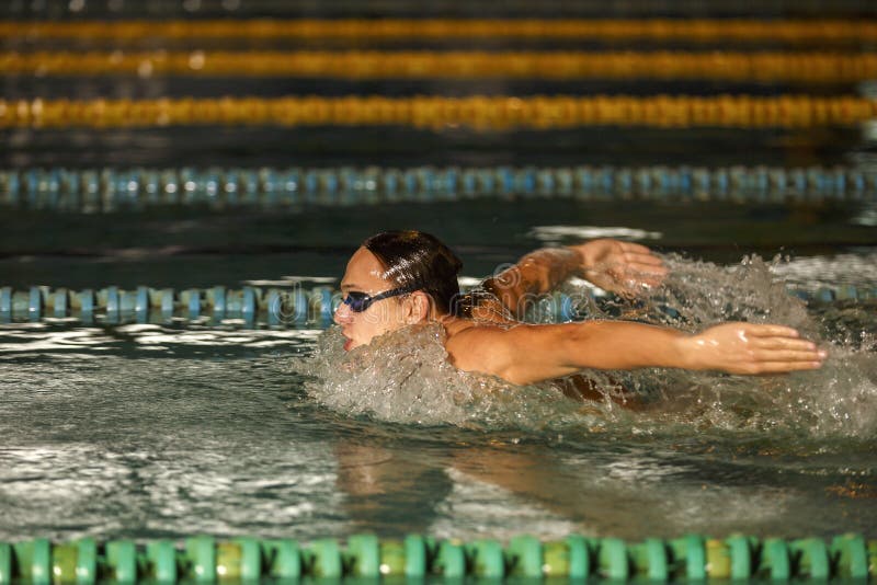 Man Swimming the Front Crawl in a Pool Stock Photo - Image of athlete ...