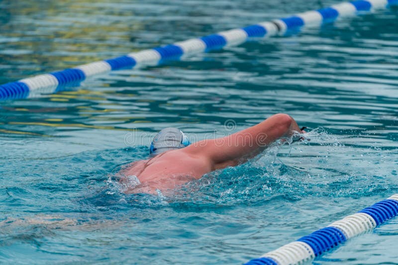 Man swimming in a pool stock photo. Image of young, sport - 136969732