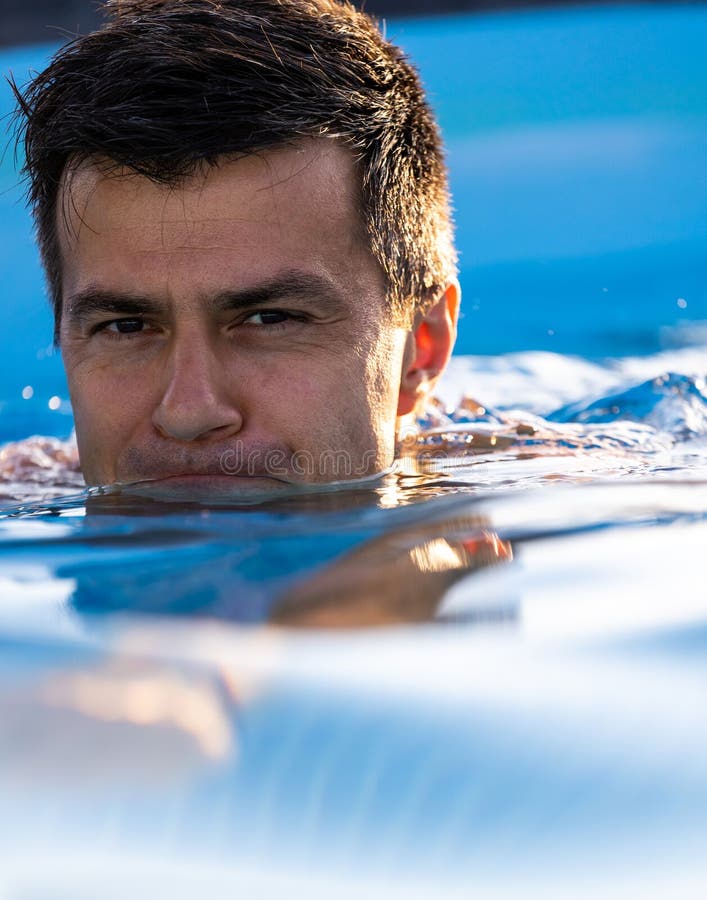 Man swimming in pool stock photo. Image of leisure, pool - 256069606