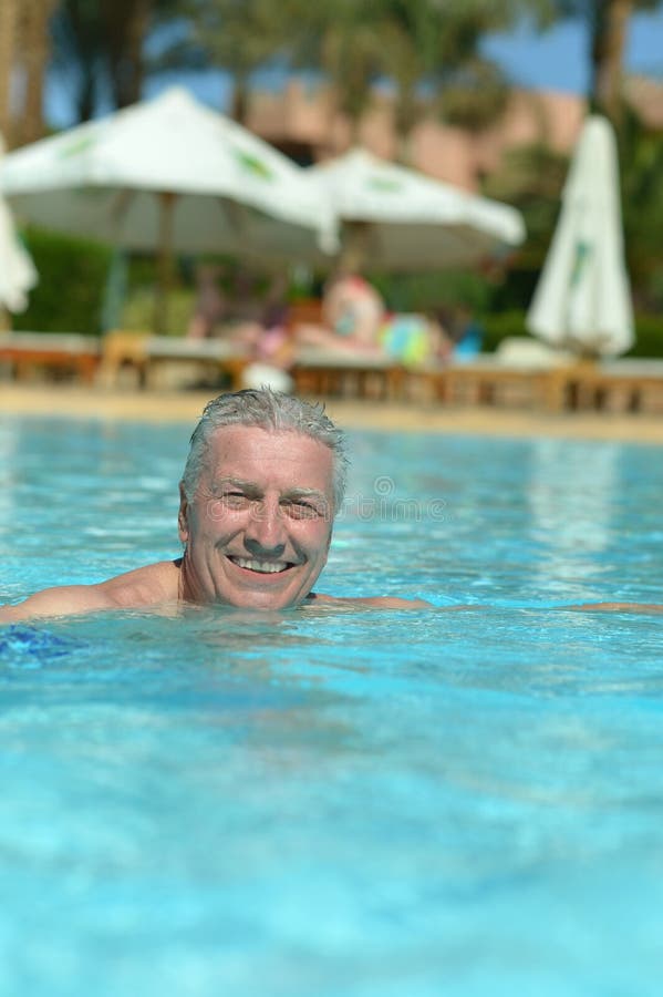 Man swimming in pool stock photo. Image of resort, happy - 40805538