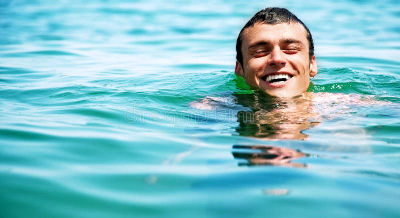 Man swimming in sea stock photo. Image of vacation, water - 18102622