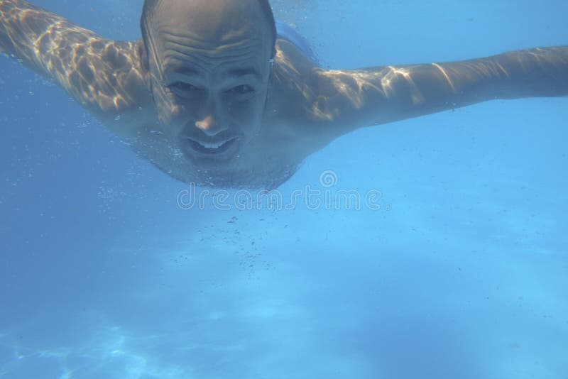 Man Swimming Underwater in a Pool Stock Image - Image of blue, swim ...