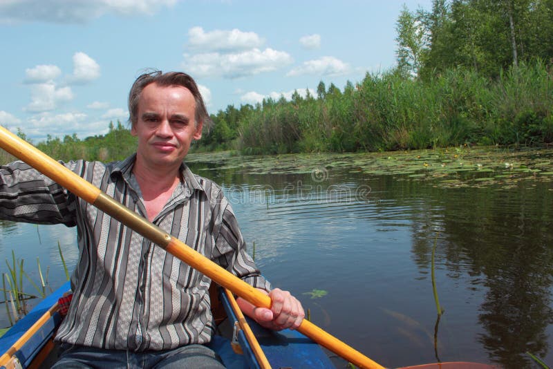 A man swims in a kayak stock image. Image of boat, recreation - 32554527 A man swims in a kayak stock image. Image of boat, recreation - 32554527