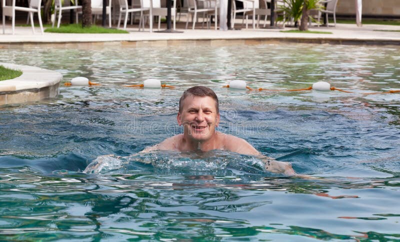 Man swims in the pool stock image. Image of floats, pool - 24846685