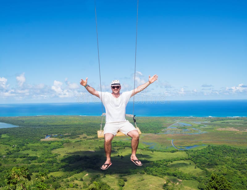 The man on a swing stock photo. Image of green, rest - 164878828