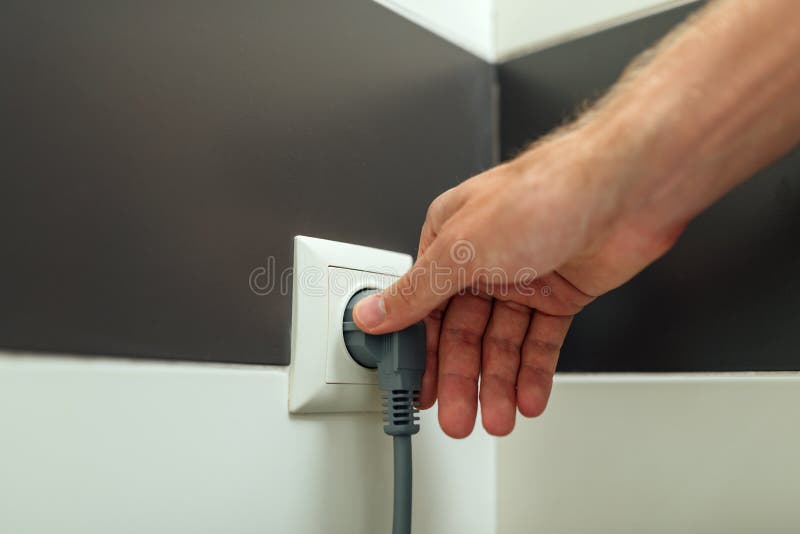 Man Holding Electric Plug Stock Photos - Download 601 Royalty Free Photos