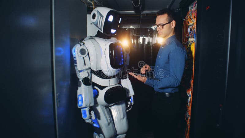 A Person Controls a Robot at a Data Center, Close Up. Stock Video ...