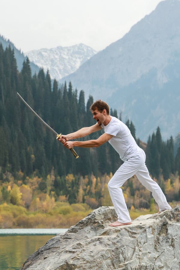 A Man with a Sword Goes on the Attack on the Enemy. the Emotional ...