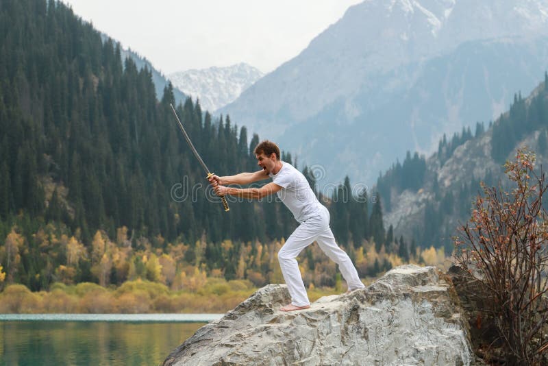 A Man with a Sword Goes on the Attack on the Enemy. the Emotional ...