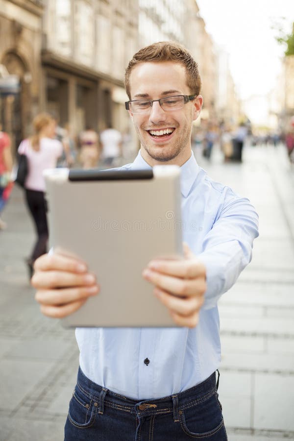 Man with Tablet Computer in Public, Smiling Stock Photo - Image of ...