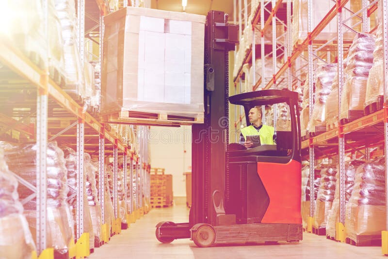 Man with Tablet Pc Operating Forklift at Warehouse Stock Photo - Image ...