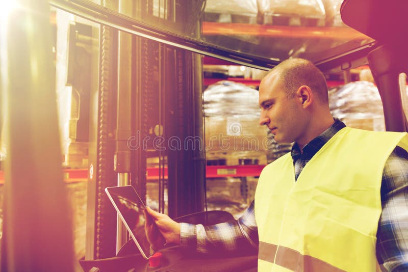 Man with Tablet Pc Operating Forklift at Warehouse Stock Image - Image ...