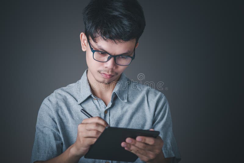A Man with a Tablet Shows Signs of Catching His Head Due To His ...