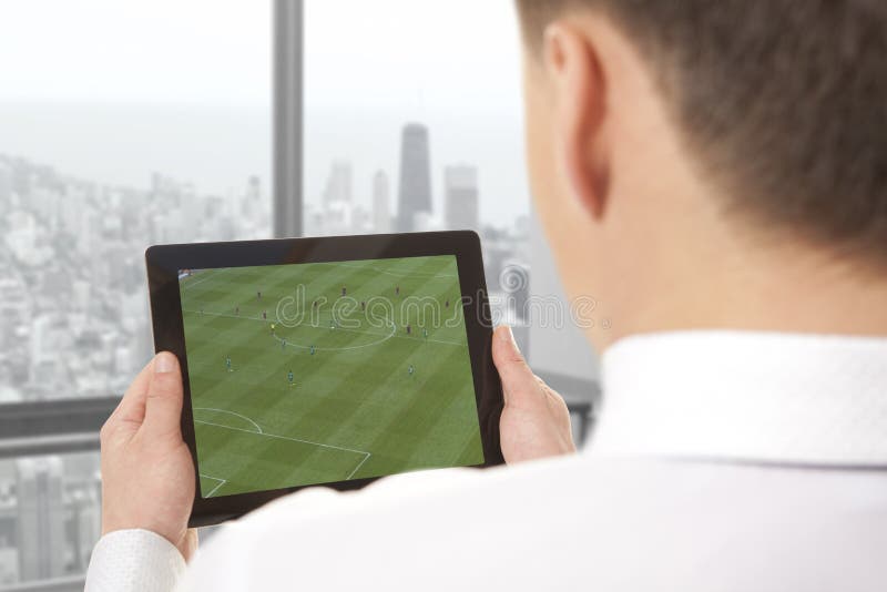 Man with Tablet with Soccer Game Stock Photo - Image of holding ...