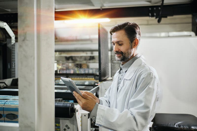 Man with Tablet Working at Polymer Factory Stock Photo - Image of ...