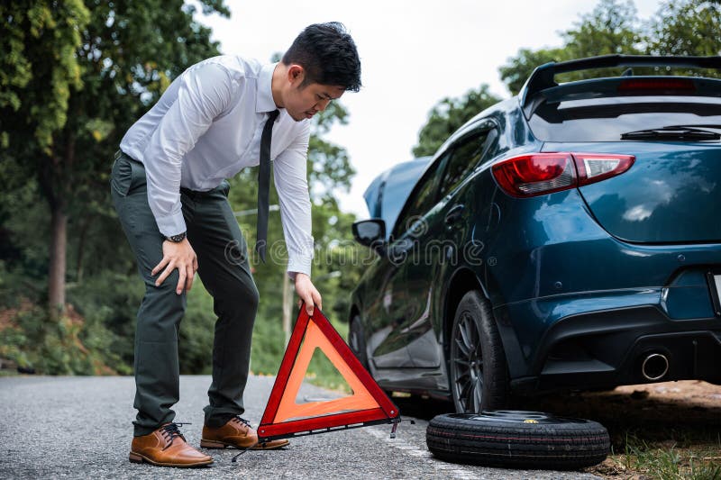 Man Take Down Red Warning Triangle. Stock Photo - Image of skill ...
