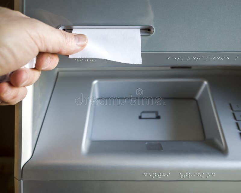A Man Takes a Check Issued by an ATM, a Check without Inscriptions, a ...