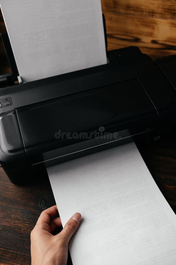A Man Takes Out Documents from the Printer. Close-up Plan Hands. Office ...