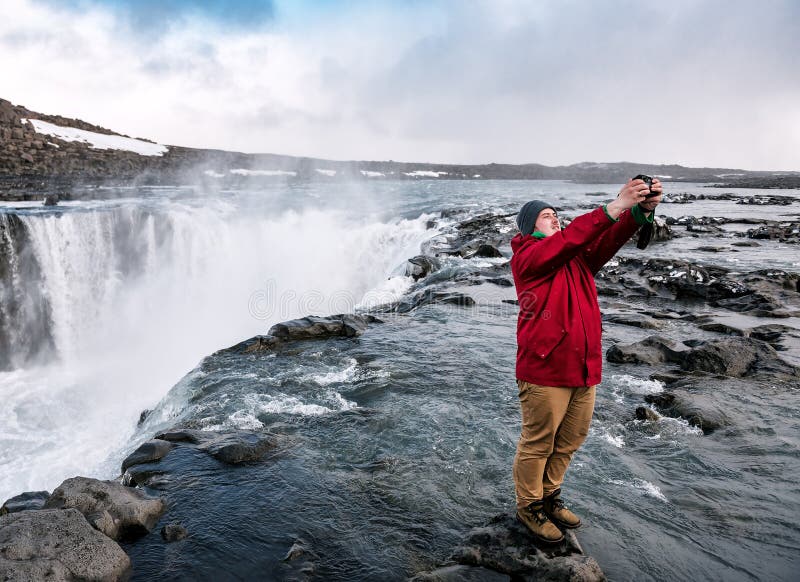 Four Friends Make a Selfie Under an Icelandic Waterfall Stock Photo ...