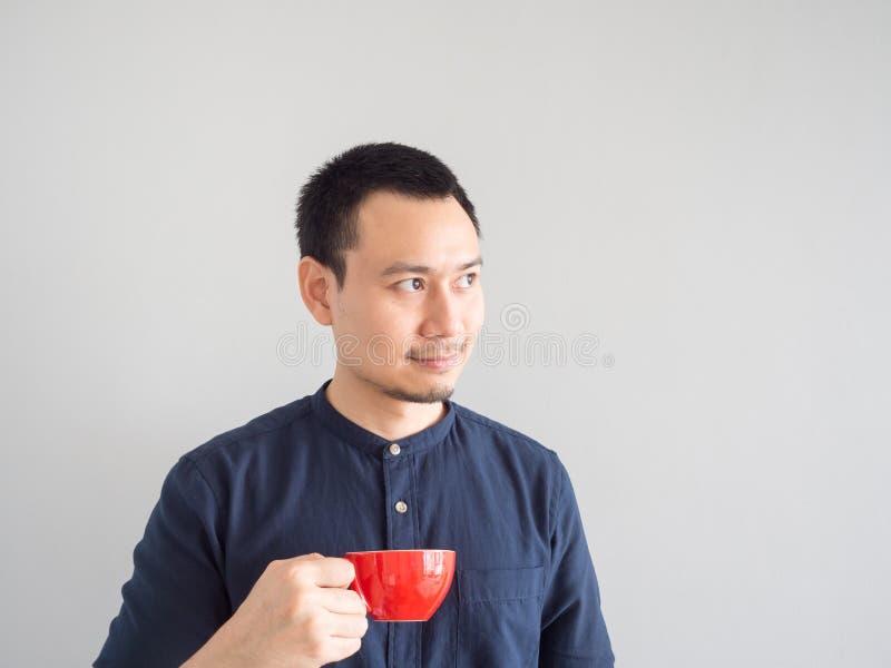 Man Takes a Sip of Coffee in Red Cup. Stock Photo - Image of holding ...