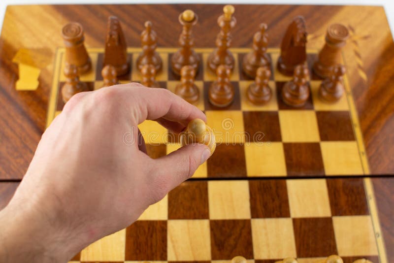 A Man Takes a Step with a Chess Piece Stock Photo - Image of battle ...