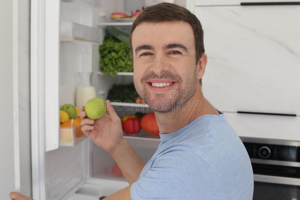 Man Taking an Apple from the Fridge Stock Image - Image of choosing ...