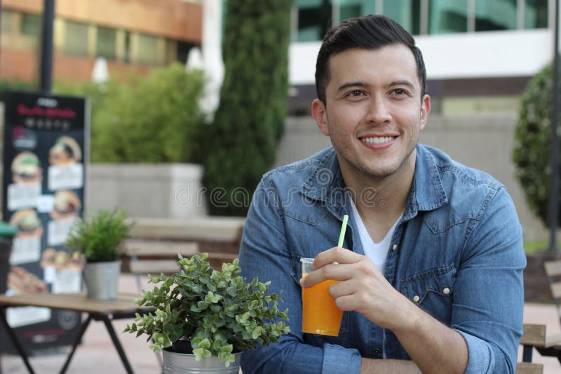 Man Taking a Break with a Cold Refreshing Orange Juice Stock Image ...