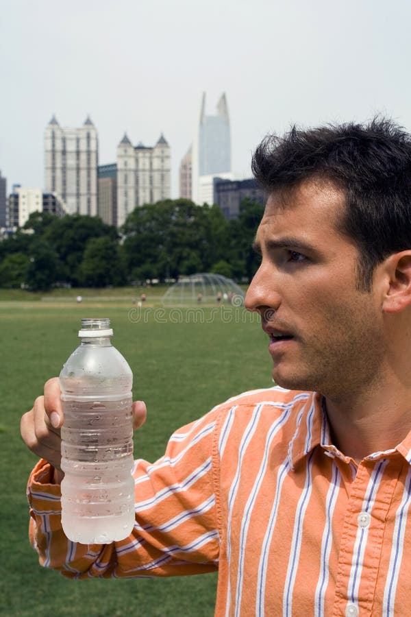 Man Taking a Break from Drinking Water Stock Photo - Image of thirsty ...