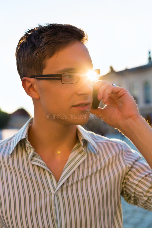 Man Taking a Call with Mobile Phone Stock Image - Image of seriously ...