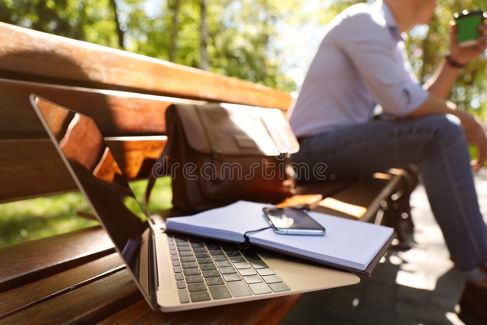 Man Taking Coffee Break during Work in Park, Focus on Laptop Stock ...
