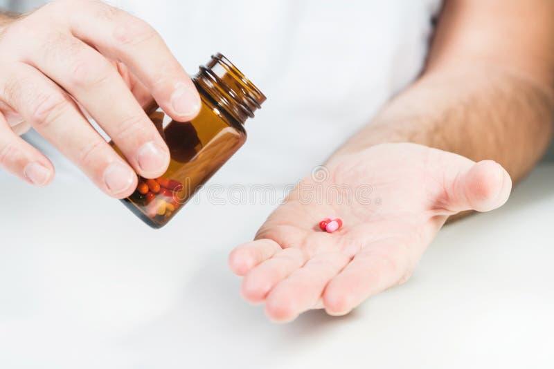 Man taking drugs stock photo. Image of addicted, container - 81115586