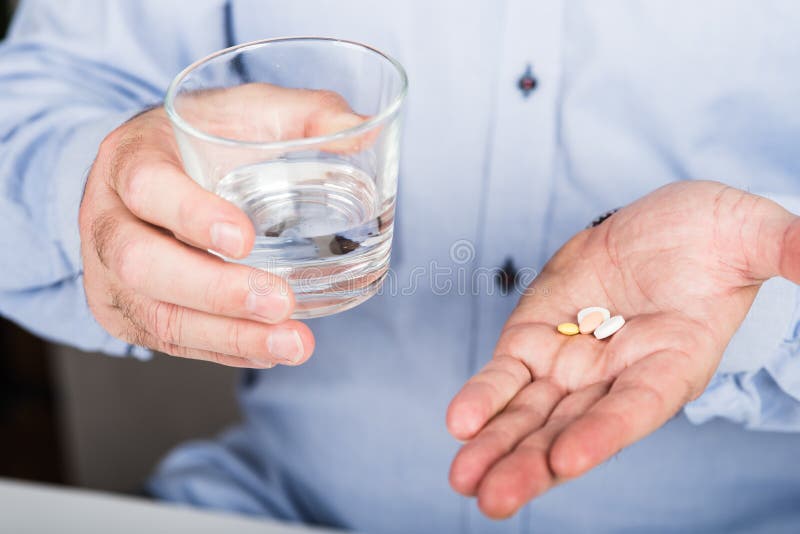 Man taking drugs stock image. Image of bottle, hospital - 81922737