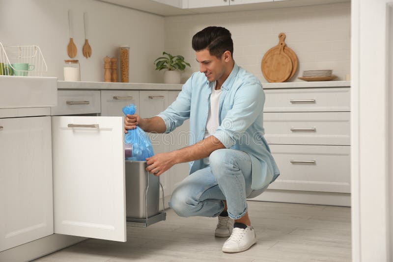 Man Taking Garbage Bag Out of Bin at Home Stock Photo - Image of adult ...