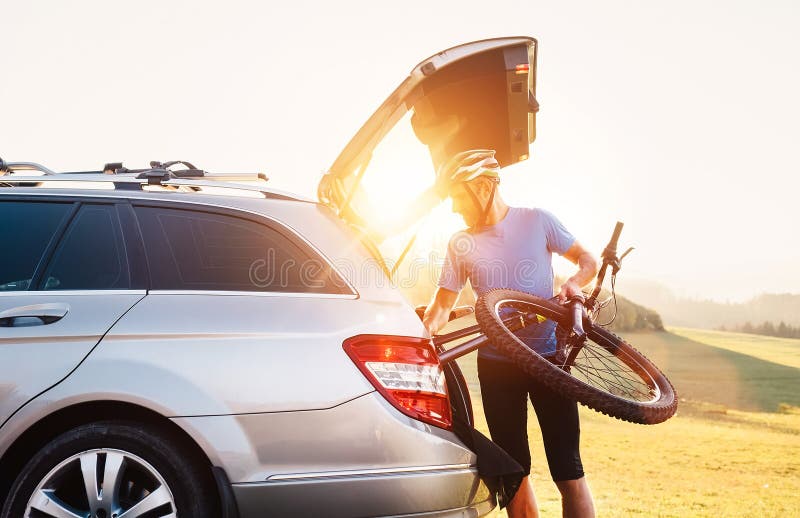 Man Taking His Bicycle Out from the Trunk of a Car Stock Image - Image ...