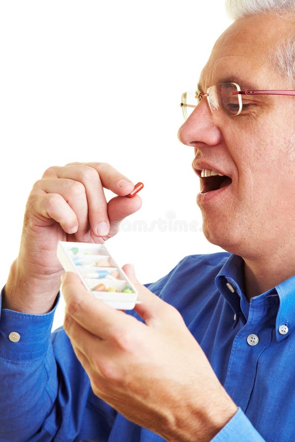 Man taking his medication stock image. Image of person - 12821835